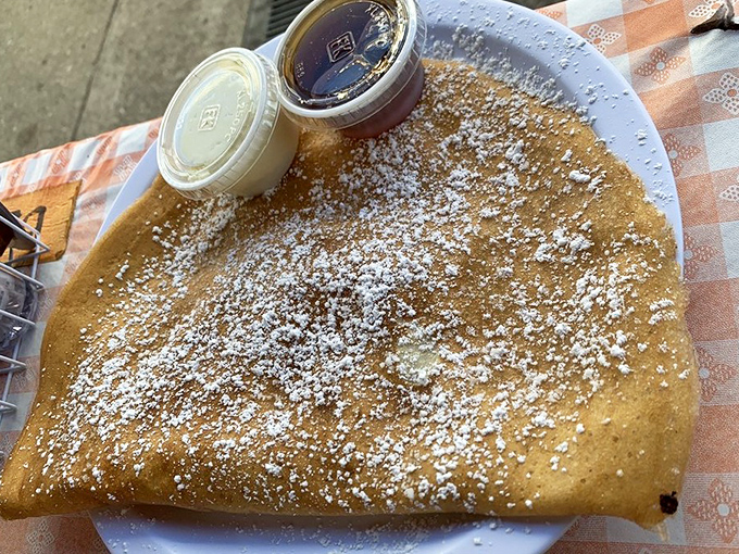 Behold the Danish pancake in its natural habitat: golden, dusted with powdered sugar, and absolutely glorious.