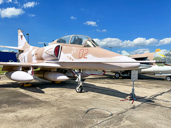 The sleek Douglas TA-4J Skyhawk wears its desert camouflage with pride, a compact fighter that proves good things come in small, supersonic packages. 