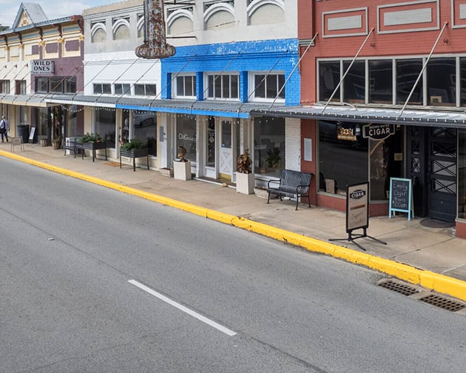Pastel-colored buildings line the street like a row of Jordan almonds, housing businesses where owners still know regular customers by name.