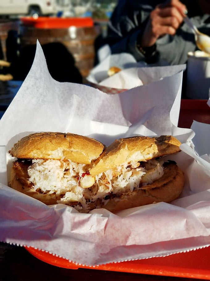 This isn't just a sandwich; it's edible poetry&mdash;sweet Dungeness crab piled high on toasted bread, no distractions, just pure oceanic bliss.