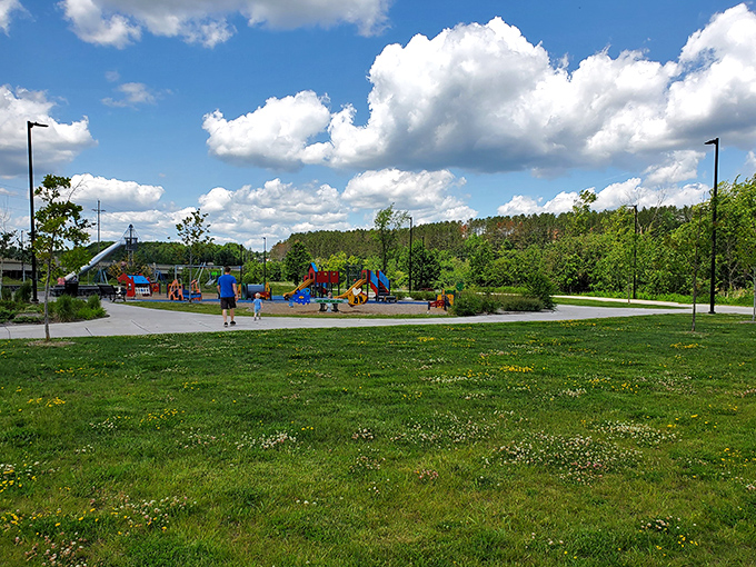 Summer splendor at its finest&mdash;Cloquet's park bandshell stands ready for concerts while the pristine water invites everyone to remember what summer felt like as a kid.
