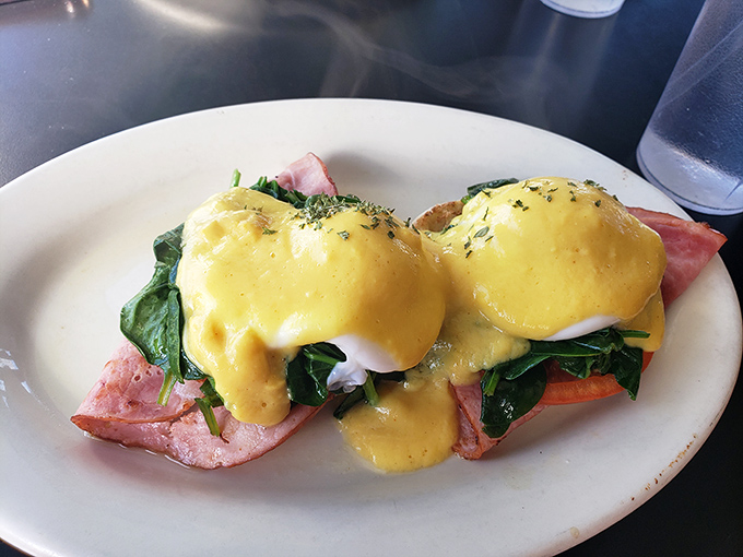 Behold the star attraction&mdash;Eggs Benedict with hollandaise so perfectly golden it deserves its own security detail. Poached eggs perched like royalty atop spinach and ham.