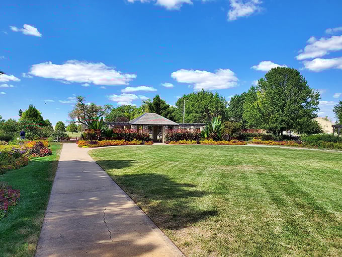 Rose gardens and manicured lawns create an oasis of color in Eisenhower Park, where Kansas sunshine works its magic on vibrant blooms.