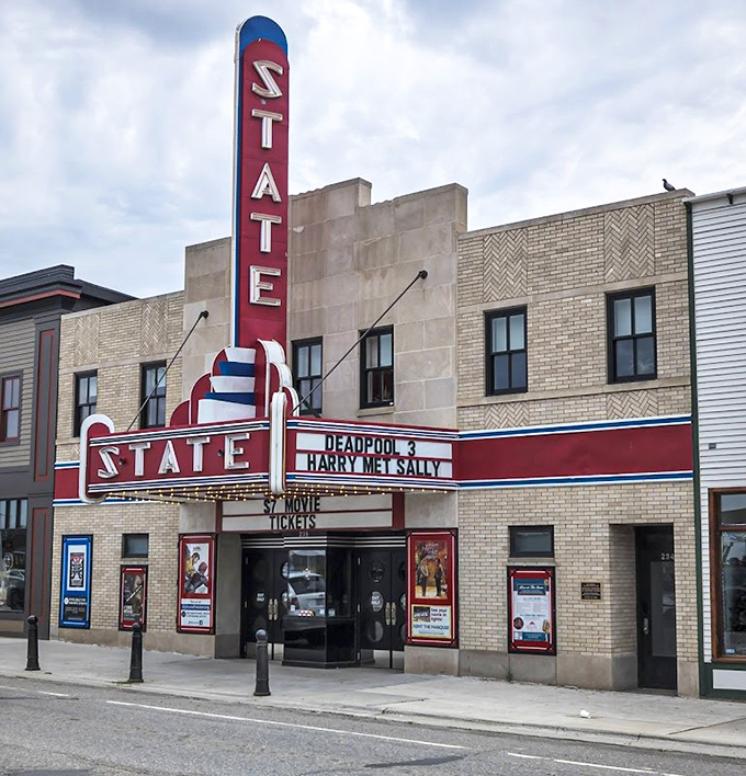 The State Theater's neon sign has been guiding moviegoers for generations, a splash of vintage glamour at the edge of wilderness country.
