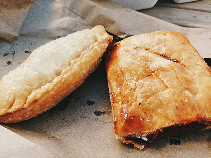 Golden-brown empanadas with flaky exteriors that shatter on first bite, revealing savory fillings that would make your abuela proud.