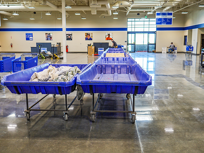 Fresh bins await their moment in the spotlight. This rare quiet moment is the calm before the bargain-hunting storm.