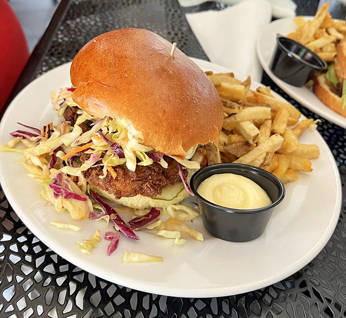 This isn't just a sandwich&mdash;it's architecture of flavor with crispy chicken, vibrant slaw, and a bun that deserves its own fan club.