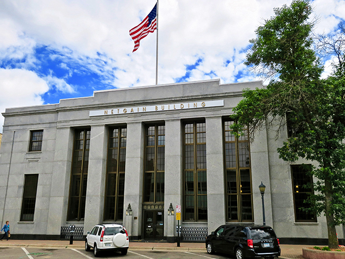 The Neigel Building stands as a granite testament to civic pride, where important decisions are made and parking spots are eternally sought.
