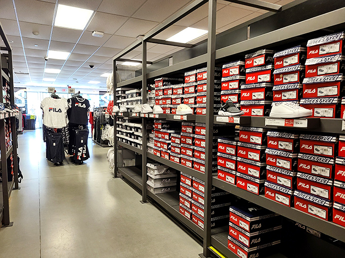 Rows of Fila boxes stacked like a sneakerhead's fever dream, proving comfort doesn't require a second mortgage payment.