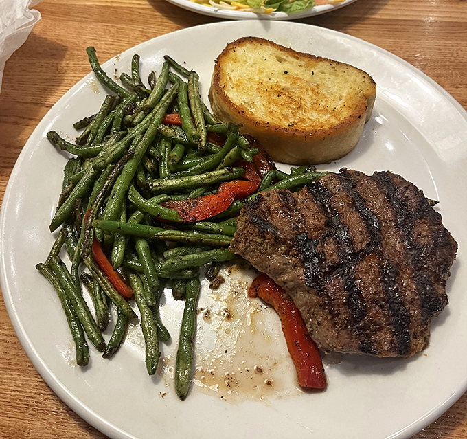 This isn't just dinner; it's a masterclass in simplicity. Perfectly grilled filet, vibrant green beans, and garlic toast&mdash;proof that great ingredients need little intervention.