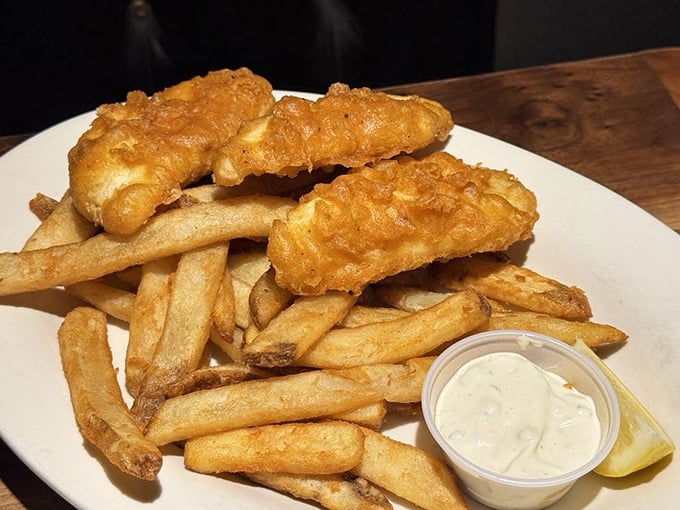 Golden-battered cod that shatters with each bite, paired with fries that deserve their own fan club.
