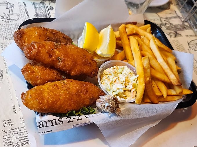 Golden-battered fish that shatters at first bite, served with proper chips and coleslaw. The kind of meal that makes you contemplate citizenship change.