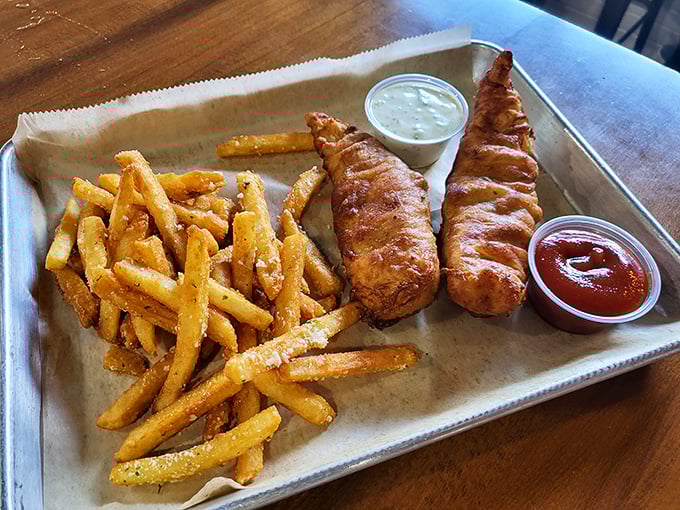 Golden-battered fish that shatters at first bite, paired with perfectly crisp fries &ndash; comfort food that deserves its legendary status.