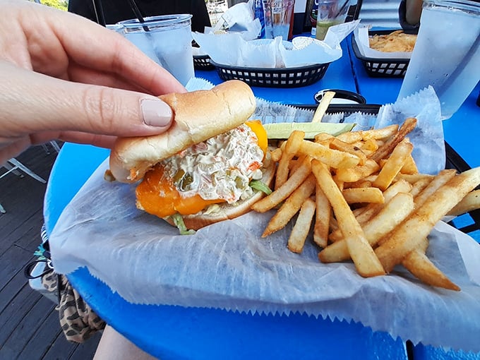 This isn't just a fish sandwich; it's summer vacation between two pieces of bread, complete with golden memories.
