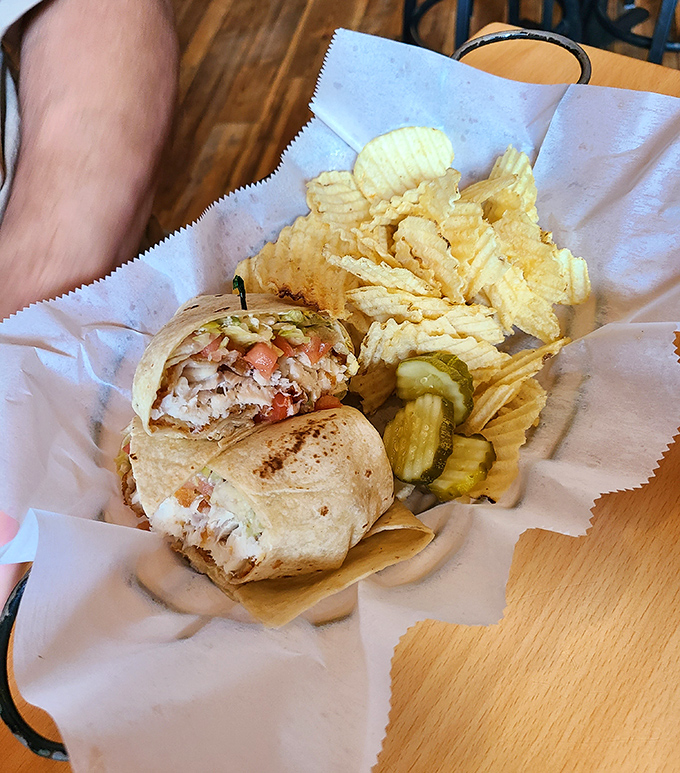 Behold the legendary fish taco wrap in all its glory! Flaky fish, fresh veggies, and that perfect sauce ratio that makes you contemplate ordering a second before finishing the first.