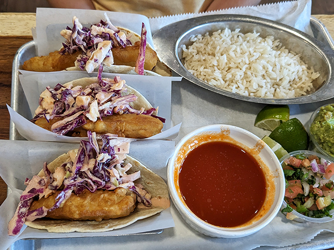 These fish tacos don't just speak&mdash;they sing. Crispy battered fish, vibrant slaw, and that sauce that makes you wonder why you'd eat anything else.