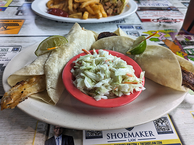 Fish tacos that make you question every other taco you've ever eaten. Served with slaw that could convert even the most dedicated cabbage-hater.