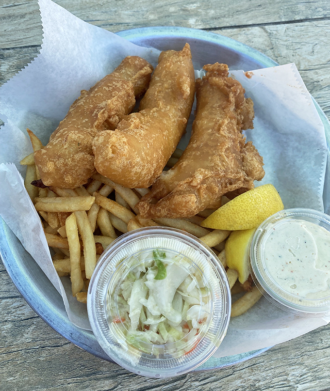 Golden-battered fish resting on a bed of perfectly crisp fries. Add house-made tartar sauce and you've got the coastal equivalent of a warm hug.
