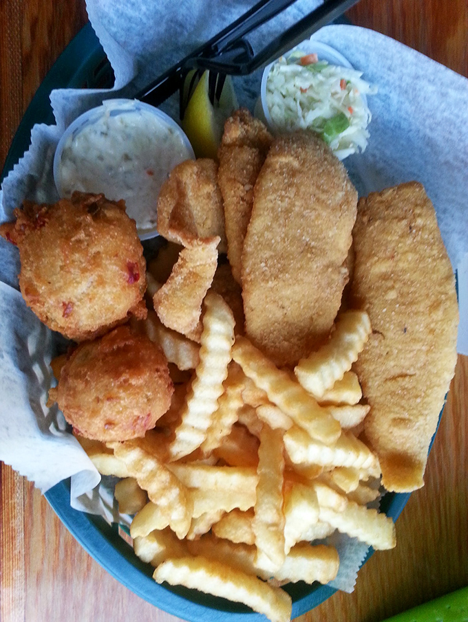 Golden-fried perfection on a blue plate special &ndash; this basket of fish, fritters, and fries is the holy trinity of beachside comfort food.
