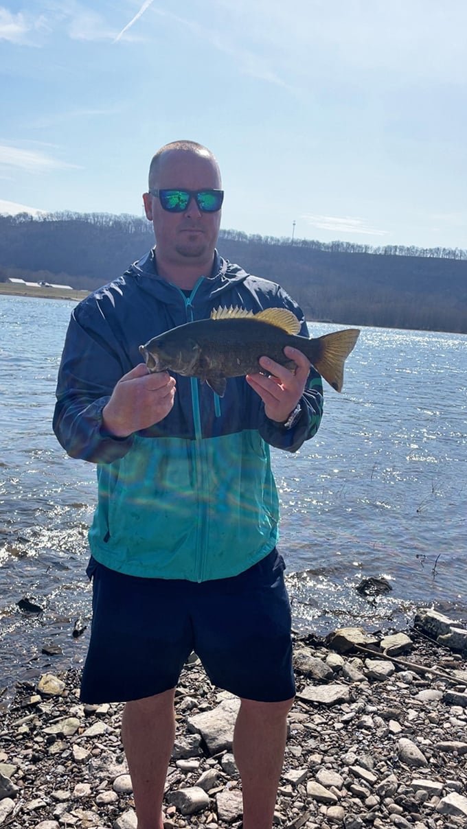 The nearby waterways aren't just pretty to look at—they're teeming with impressive catches like this smallmouth bass. Weekend fishing trips here quickly become retirement traditions.