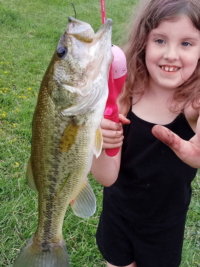 Nothing says "retirement victory" like teaching the grandkids to fish. This bass is almost as big as her smile!