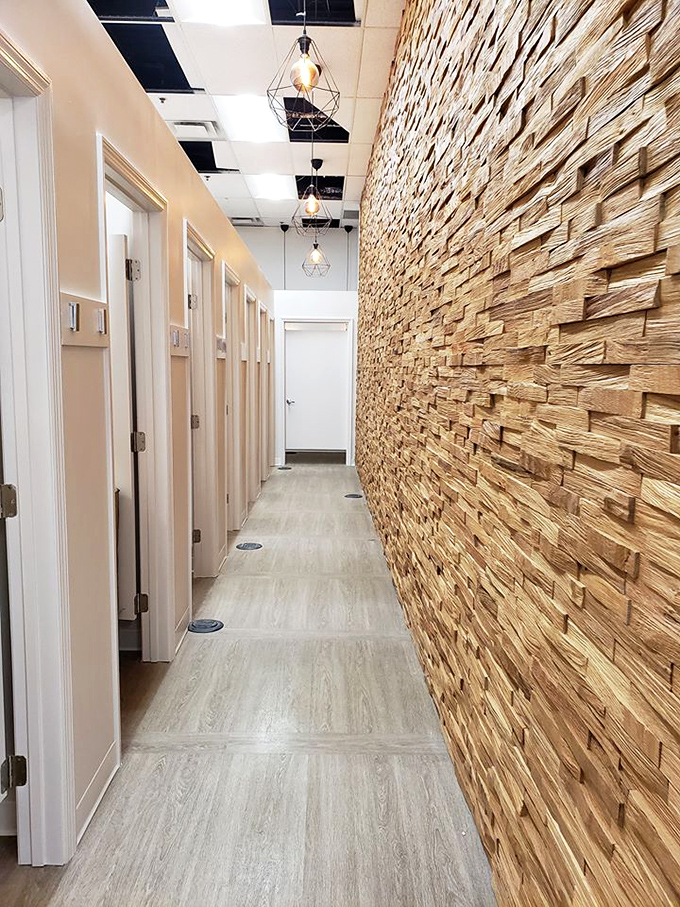 Even the fitting rooms got the memo about style—textured stone walls and designer lighting transform trying on pre-loved fashion into a boutique experience.