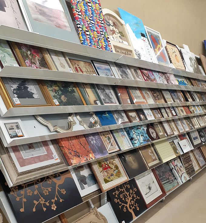 Wall art galore&mdash;because nothing says "cultured adult" like rescuing someone else's abandoned Mona Lisa reproduction for your guest bathroom. 