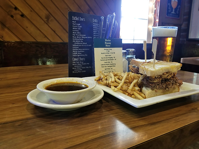 The legendary French dip in all its glory&mdash;tender beef, golden fries, and that magical jus that transforms every bite into a moment of pure, unadulterated joy.