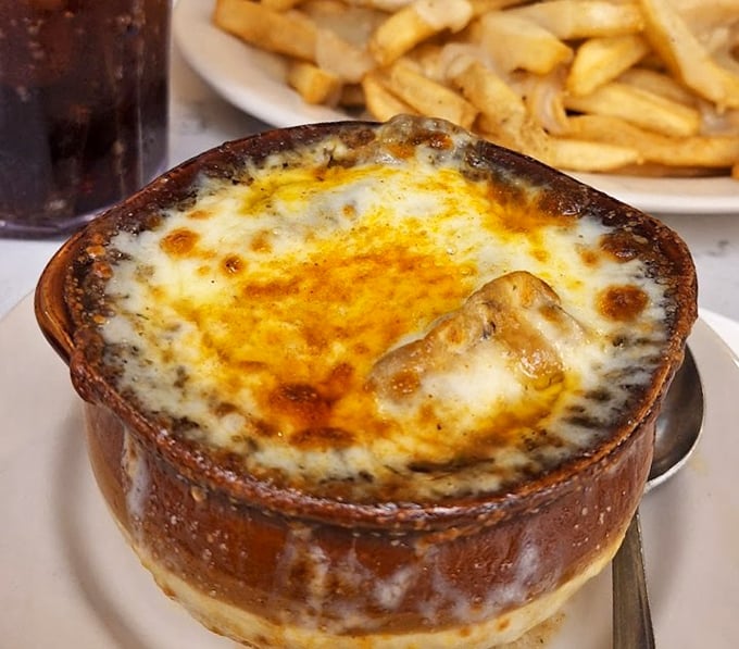 This French onion soup isn't just a dish&mdash;it's a religious experience. That cheese pull could win Olympic medals for both distance and style.
