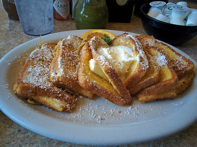 French toast that makes you question every other breakfast you've ever had. Golden, crispy edges with a custardy center – the breakfast equivalent of hitting the lottery.