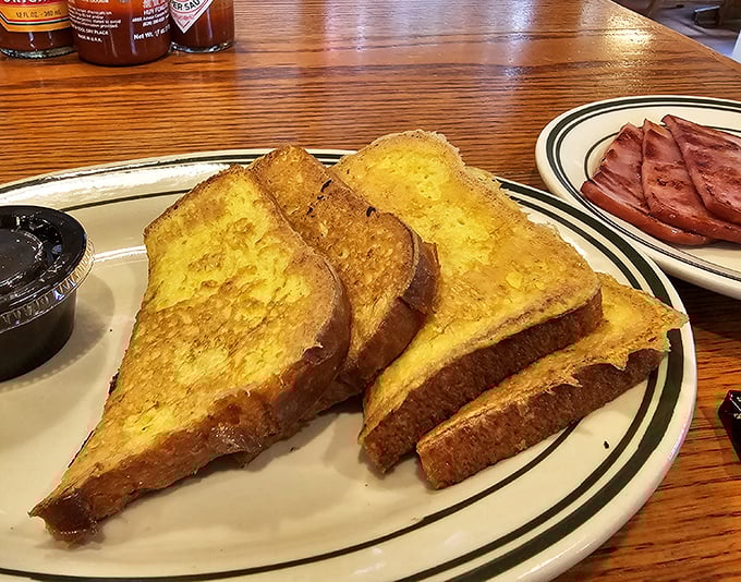 Golden-brown perfection on a plate. This French toast has that magical crisp exterior and custardy interior that breakfast dreams are made of.