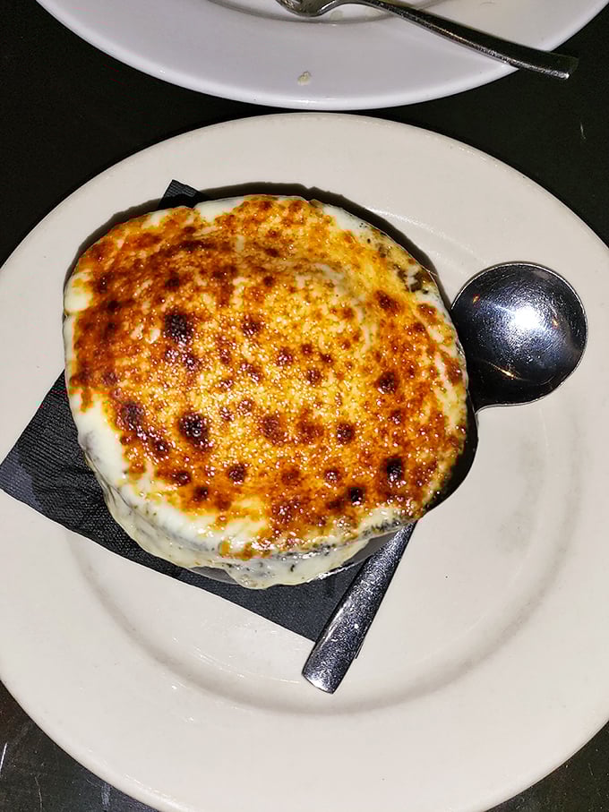 That golden-brown, bubbly cheese crust on this French onion soup is just begging to be cracked open. Pure comfort in a bowl!