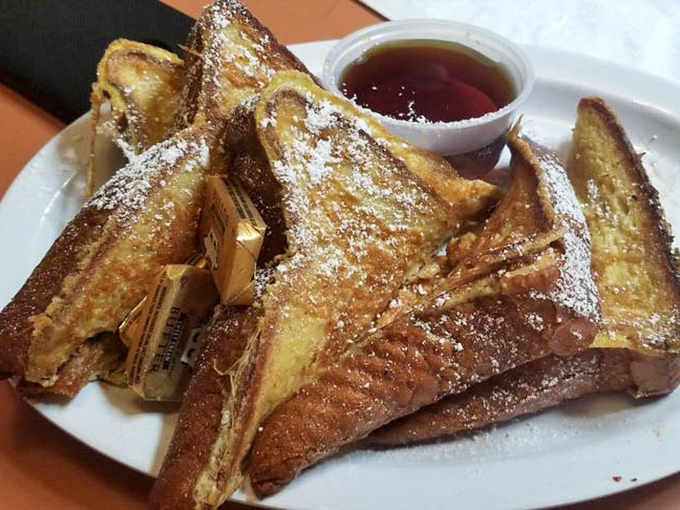 Harbor House's French toast arrives like a golden-brown postcard from breakfast heaven&mdash;crispy edges, custardy centers, and that perfect dusting of powdered sugar.