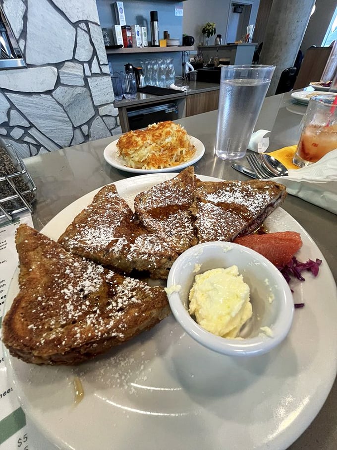 French toast that's dressed for success with powdered sugar and fresh berries. The crispy exterior gives way to a custard-like center that makes mornings worthwhile.