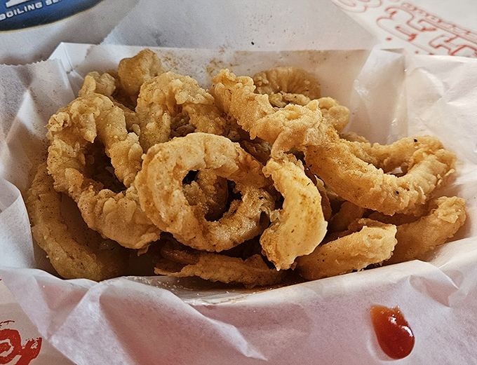 Golden rings of calamari perfection &ndash; crispy enough to make your cardiologist nervous, delicious enough not to care.