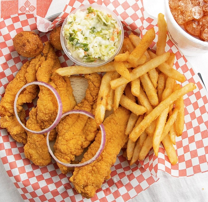 Golden-fried catfish strips that shatter with each bite, nestled alongside crispy fries and fresh slaw. This is Tennessee's answer to fine dining.