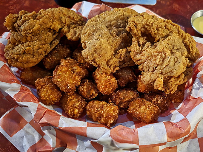Golden-brown perfection! This basket of fried chicken delivers that soul-satisfying crunch that makes time stand still and conversation pause mid-sentence.