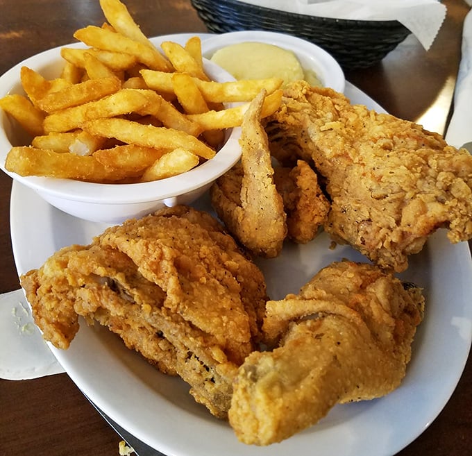 Golden-brown perfection that makes you question every other fried chicken you've ever eaten. The crunch heard 'round Atlanta.
