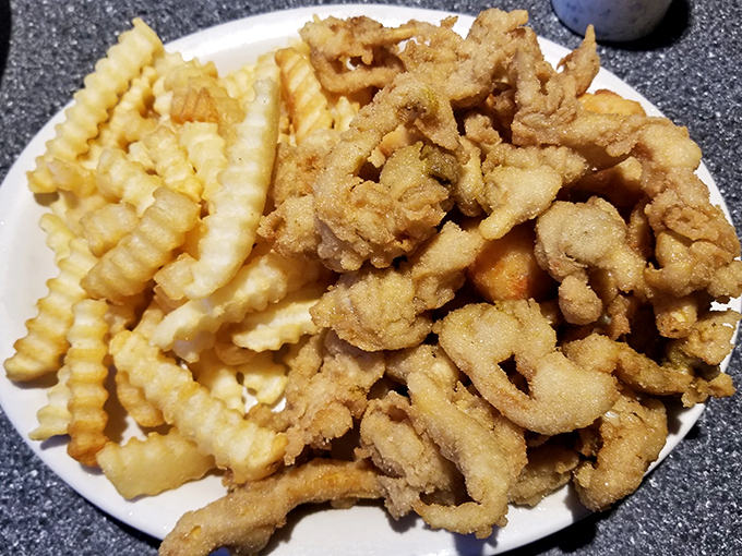 Golden-fried whole belly clams and crinkle-cut fries – the kind of plate that makes you wonder why anyone bothers with fancy food.