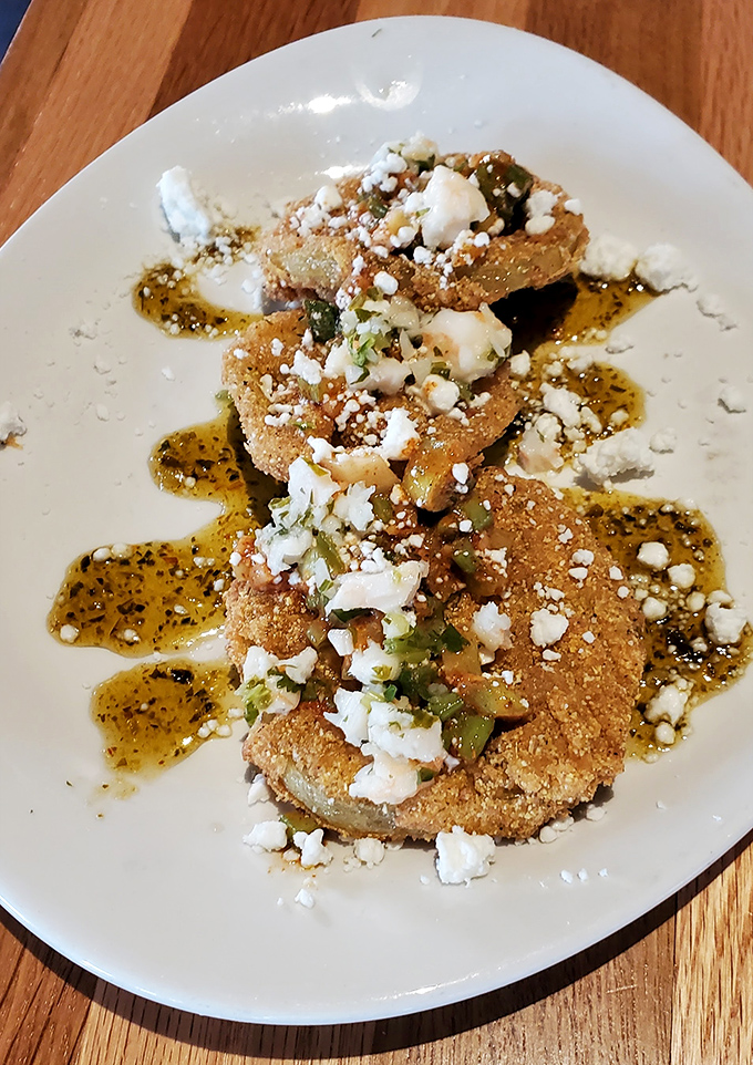 These fried green tomatoes arrive dressed to impress &ndash; feta crumbles and balsamic making them red-carpet ready.