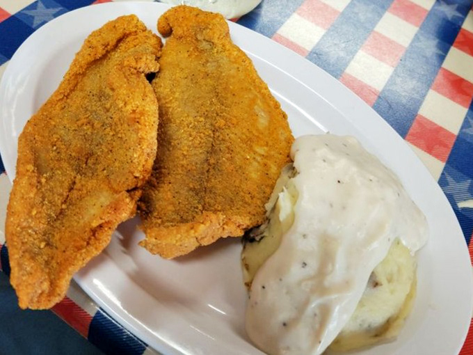 Golden-crusted catfish fillets that shatter with each bite, paired with creamy mashed potatoes. This isn't just dinner—it's edible Southern poetry.