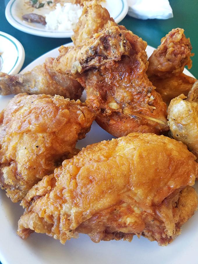 Golden-brown perfection that makes Colonel Sanders look like an amateur. This chicken's crackling skin gives way to juicy meat that'll haunt your dreams.