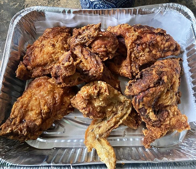 Golden-brown perfection that makes you understand why people cross county lines for chicken. That crust has more character than most Hollywood blockbusters.