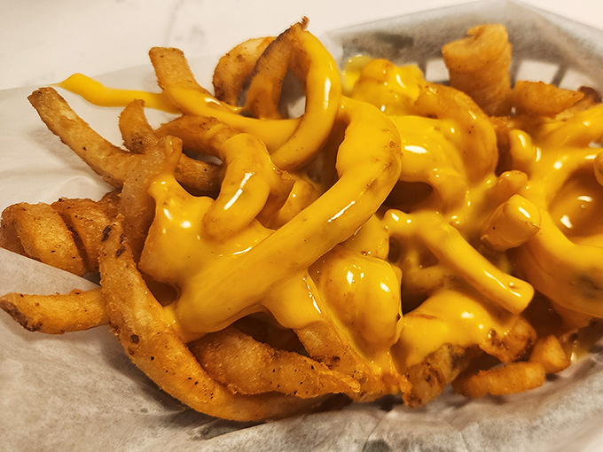 Golden fries swimming in a cheese sauce so good it should have its own area code. Diet plans, consider yourselves postponed.