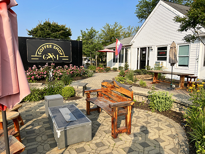 GNM Coffee Shop's inviting patio garden creates the perfect morning sanctuary. Those rustic wooden benches practically beg you to linger over a second cup.