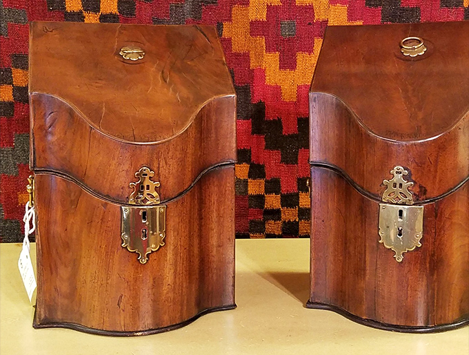 Twin wooden knife boxes with brass hardware&mdash;the 18th-century equivalent of matching Louis Vuitton luggage for your silverware.