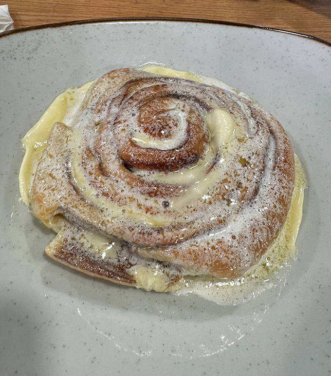 The legendary cinnamon roll doesn't just arrive at your table&mdash;it makes an entrance, swimming in butter sauce like Michael Phelps in Olympic glory.