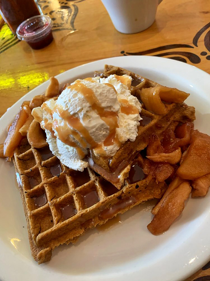 This isn't just any waffle &ndash; it's a golden throne for honey-whipped cream and caramelized apples that would make Belgian royalty weep with joy.