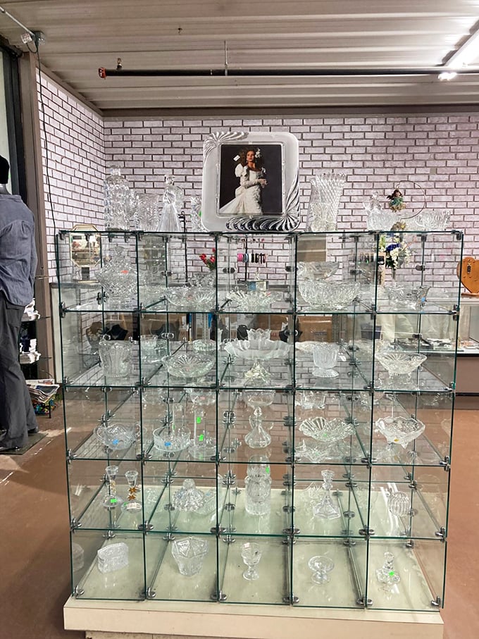 Crystal and glassware gleam like diamonds in this elegant display case&mdash;each piece whispering tales of dinner parties past and celebrations yet to come.
