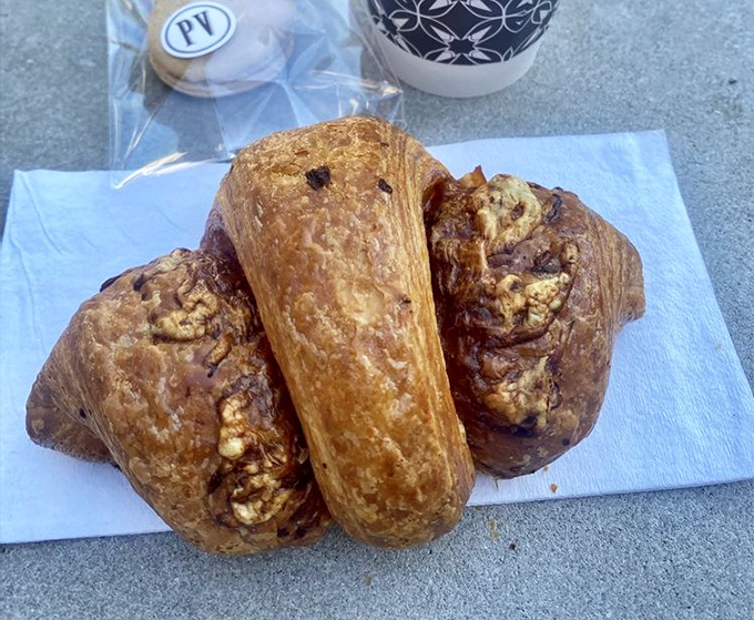 Behold the holy grail of breakfast: layers of buttery pastry embracing ham and cheese in what can only be described as morning nirvana.